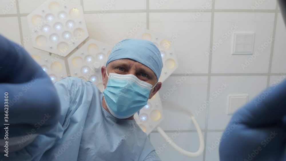 Doctor pathologist opens plastic bag with a dead body inside in ...