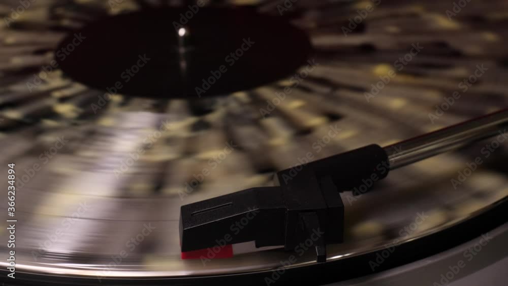 12” grey splatter vinyl record spinning on a DJ turntable. Retro LP ...