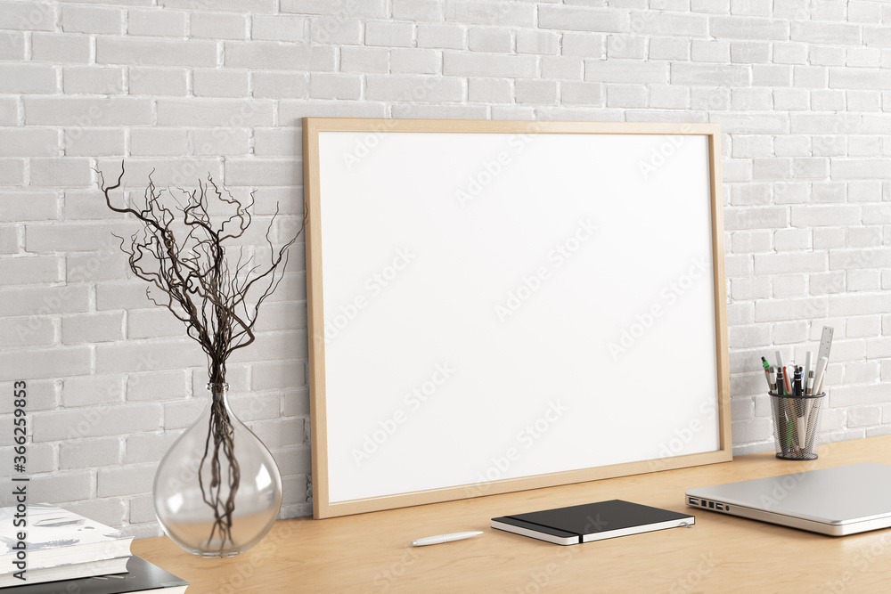 Horizontal poster frame mockup on the wooden table of home studio ...