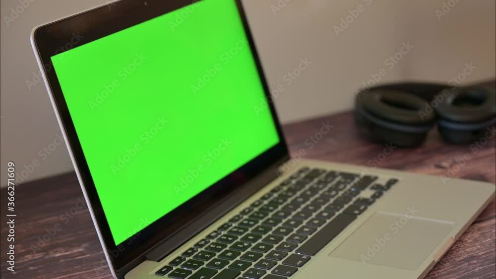 4K Green Screen Of Laptop Computer Set On Working Space, Pan Shot Stock ...