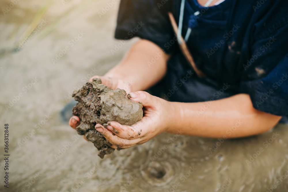 Kids playing in the clay muddy puddle field. This activity is good for ...