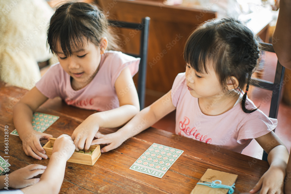 Kids playing board game at their home. Table top game is a good ...