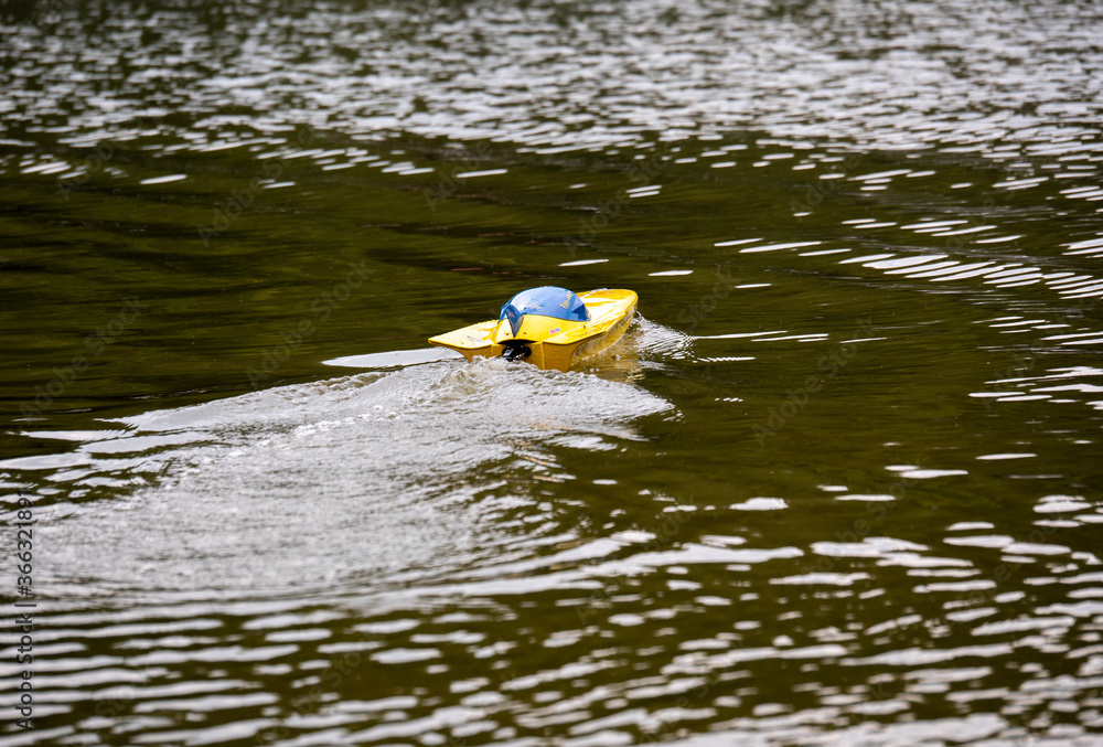 RC controlled jet boat model on lake. Active summer vacation for school ...