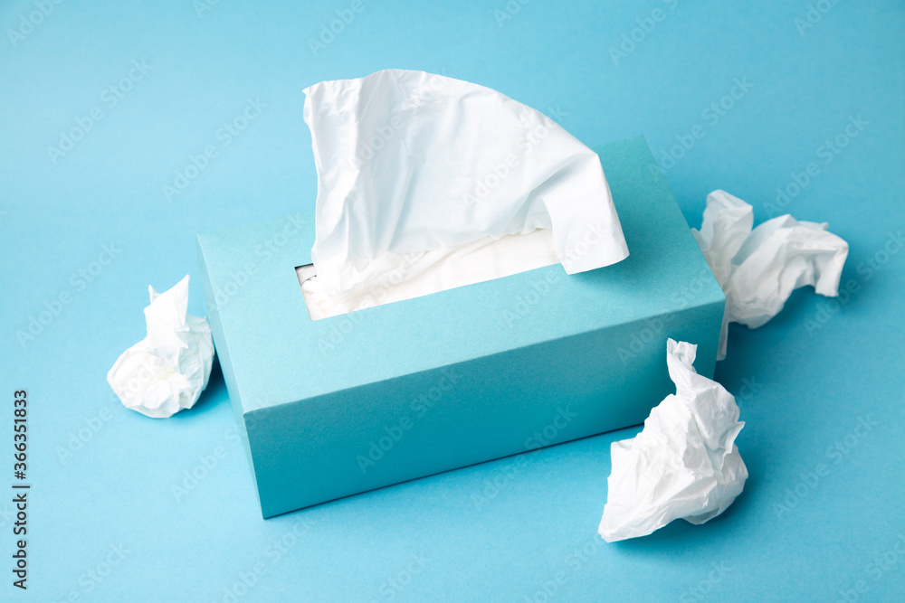 Cold and flu concept with a tissue box and crumpled tissues Stock Photo ...