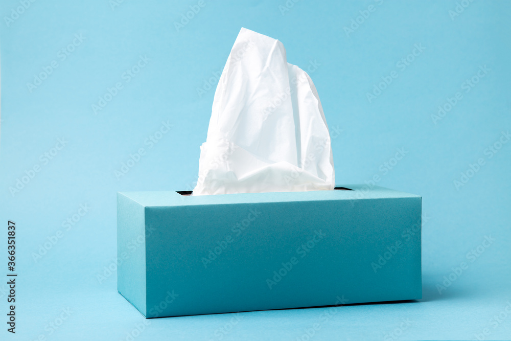 Blue tissue box on a blue background Stock Photo | Adobe Stock