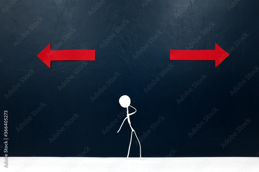 Human stick figure choosing between red left ot right arrows cutout ...