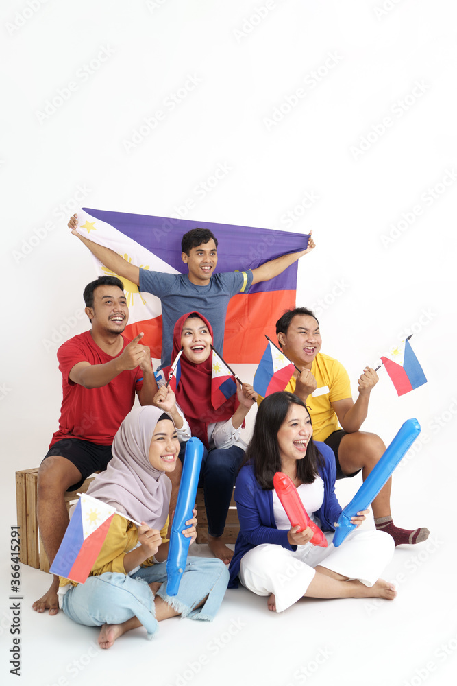 filipino group of people holding philippines flag celebrating ...