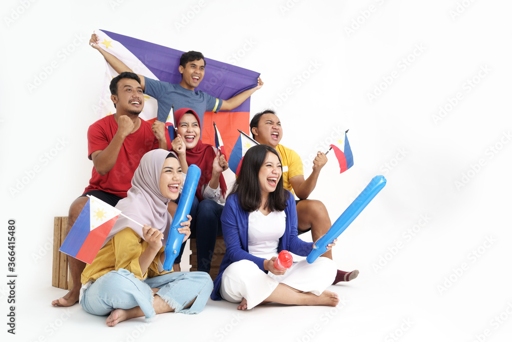 filipino group of people holding philippines flag celebrating ...