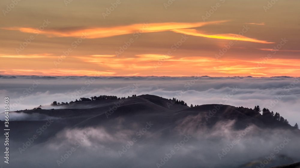 Sunset above the clouds. Fog covering the Pacific Ocean as seen from ...