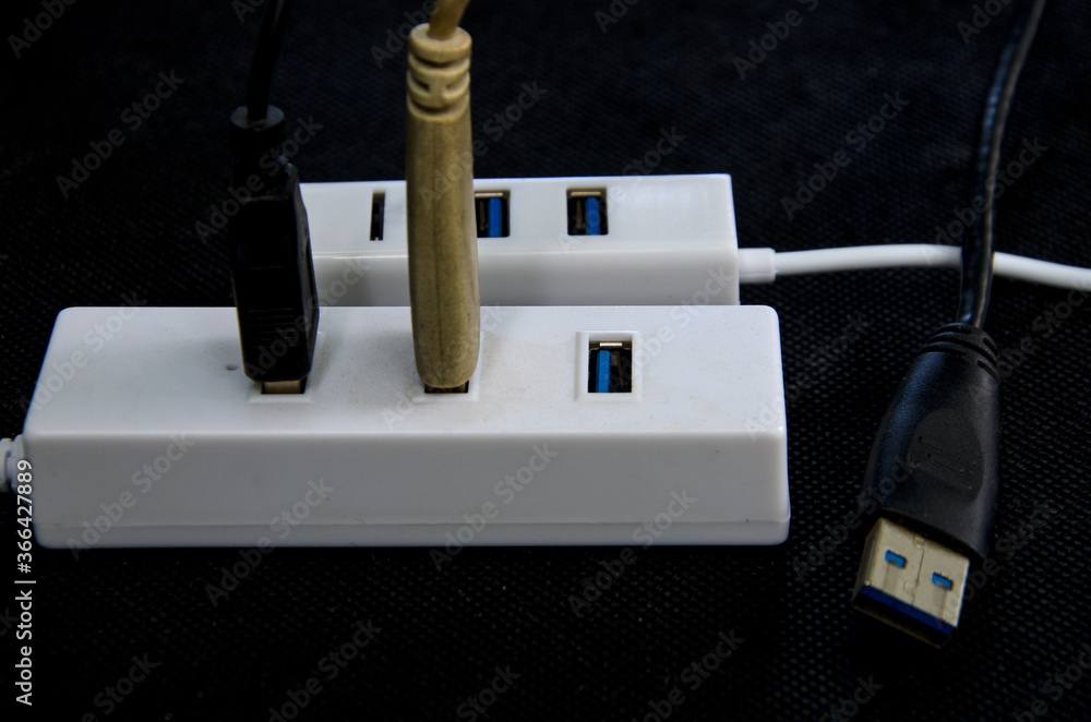 Universal serial bus conector hub and cable on black background Stock ...