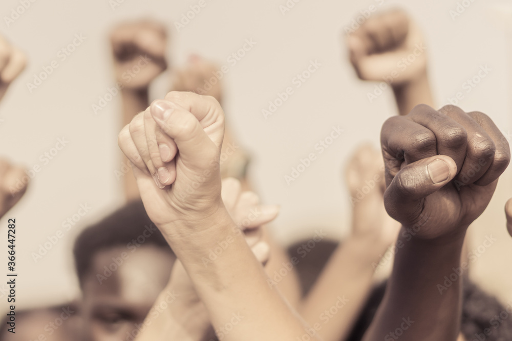 People raised fist air fighting for their rights. Labor movement ...