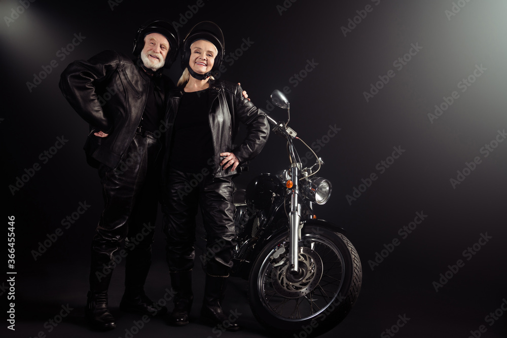 Full length photo of old cool woman man biker couple hug embrace ready ...