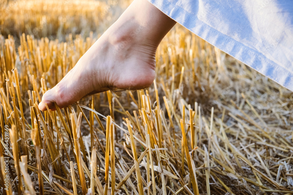 Overcome obstacles depression concept. A woman's bare foot makes a step ...