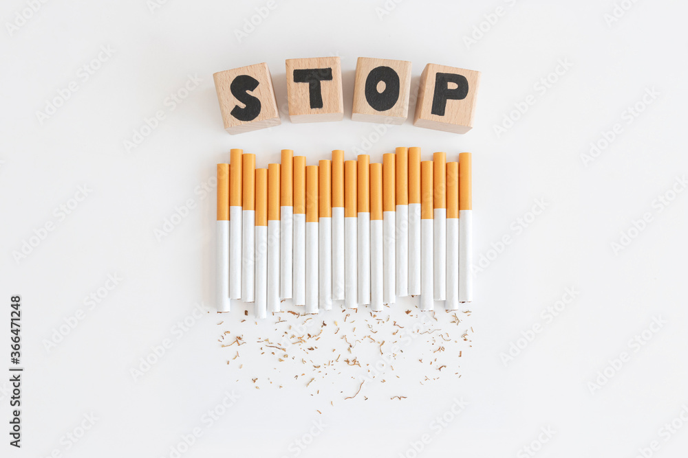 Overhead view of stop text wood cube from cigarette, Stop smoking ...