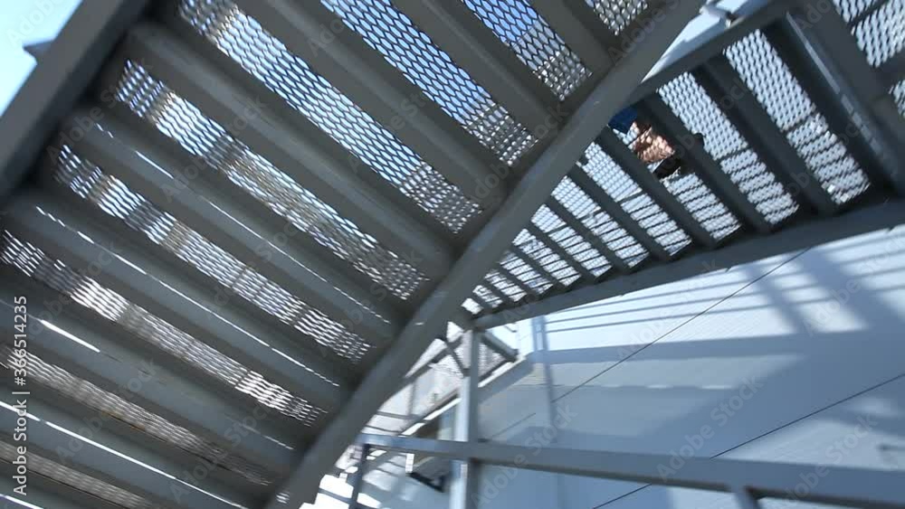 Bottom camera 360 degree view on man in suit using climbing modern ...