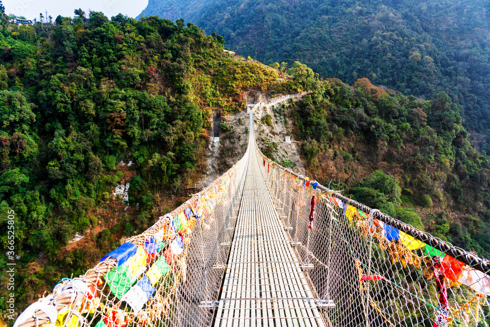 Suspension bridge on a popular tourist destination trail - Annapurna ...