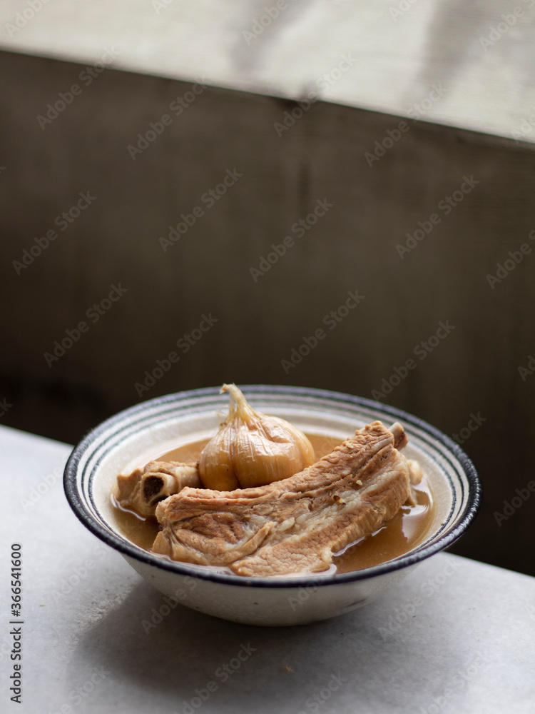 Bak kut teh or Bakut is a pork rib dish cooked in broth, served in ...