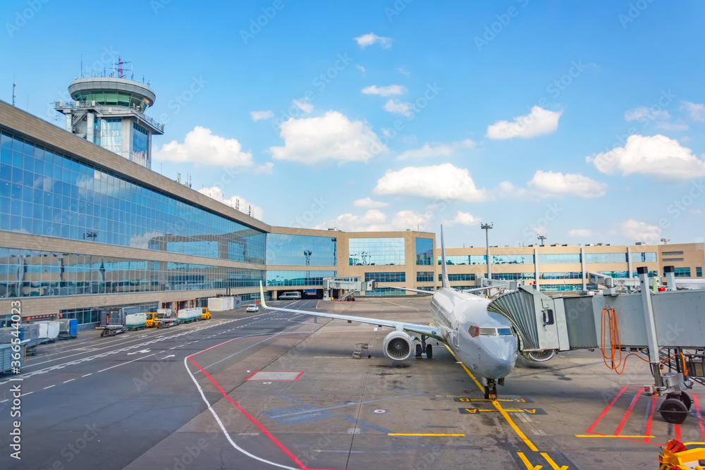 Air control tower and passenger terminal in building international ... Air control tower and passenger terminal in building international ...