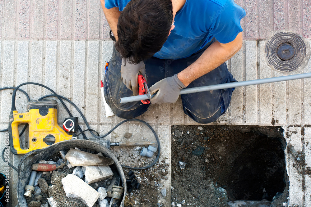 plumber worker repair and replace plastic water pipes because of a ...