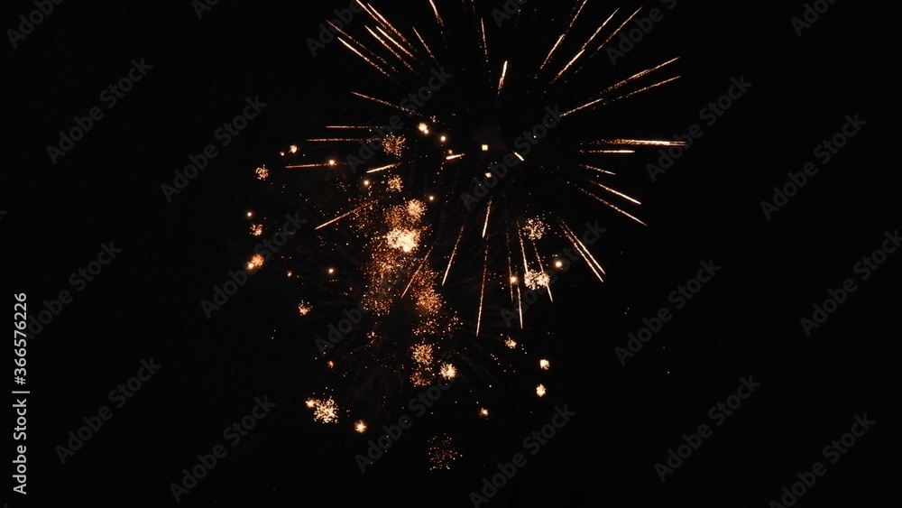 Shot of exploding fireworks in a black night sky Stock Photo | Adobe Stock