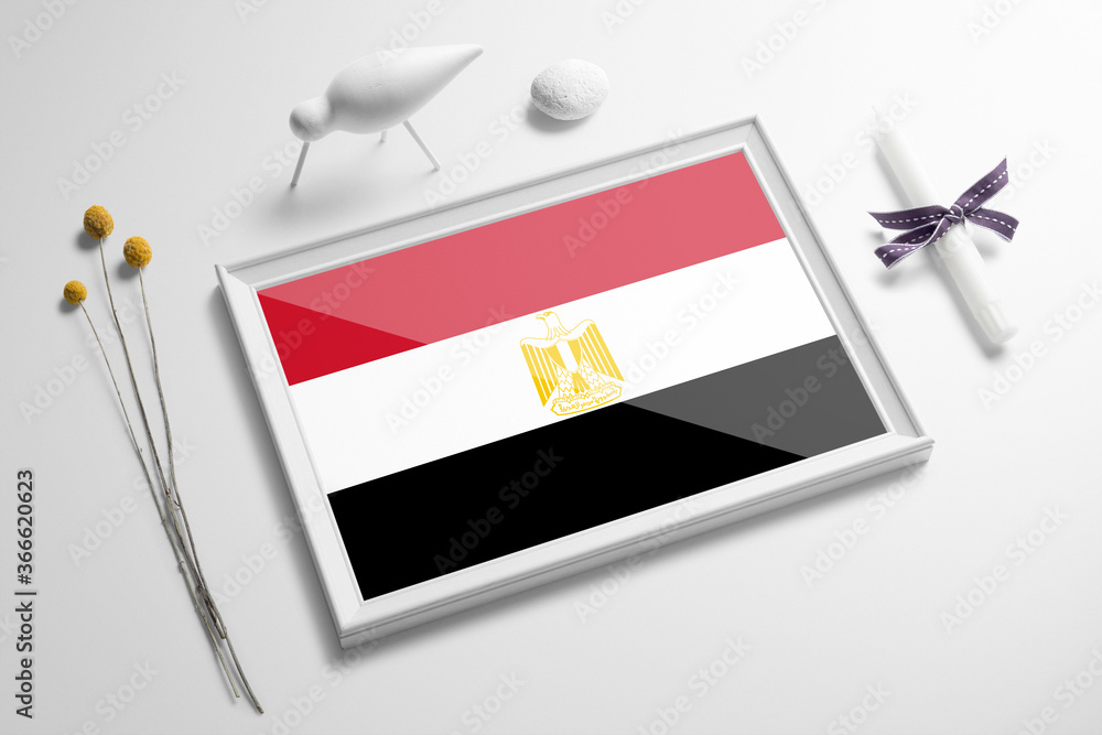 Foto de Egypt flag in wooden frame on table. White natural soft concept ...