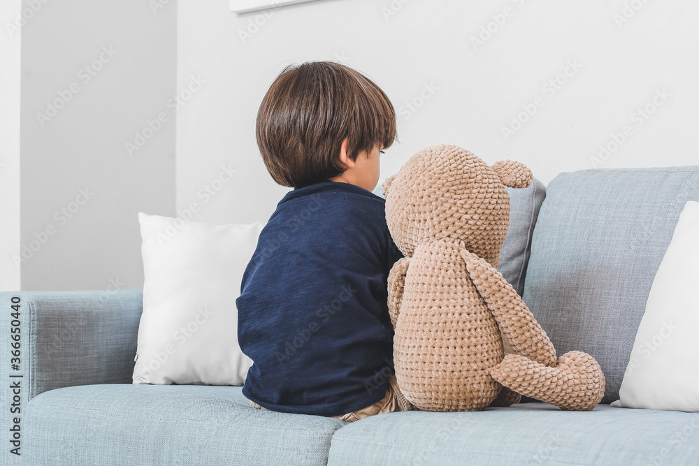 Sad little boy with autistic disorder at home Stock Photo | Adobe Stock