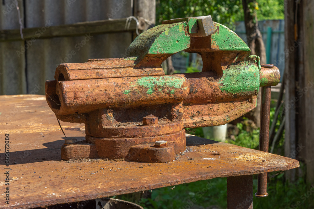 Old rusty steel clamp vise iron metal tool in the workshop workbench in ...