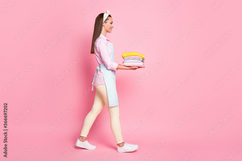 Full size profile side photo of positive cheerful girl maid hold neat ...