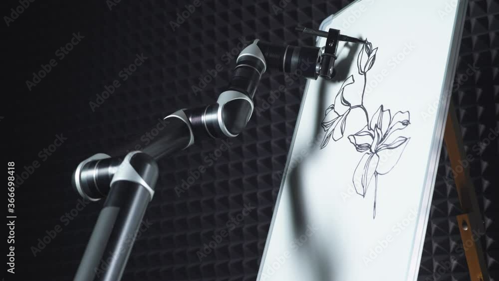 Programmed robot draws a flowers, a futuristic robot hand draws a ...