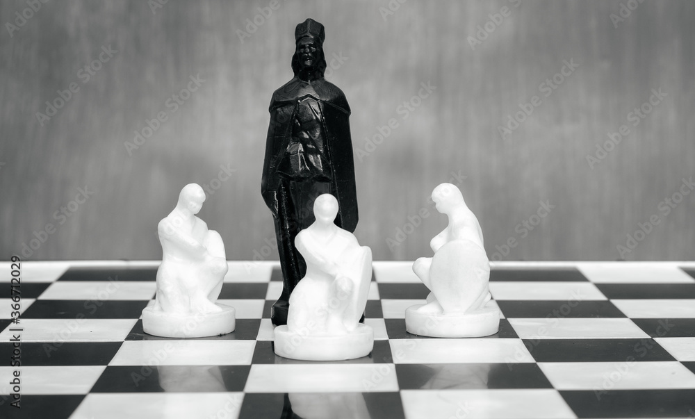 Black and white chess pieces on the chessboard. The concept of ...