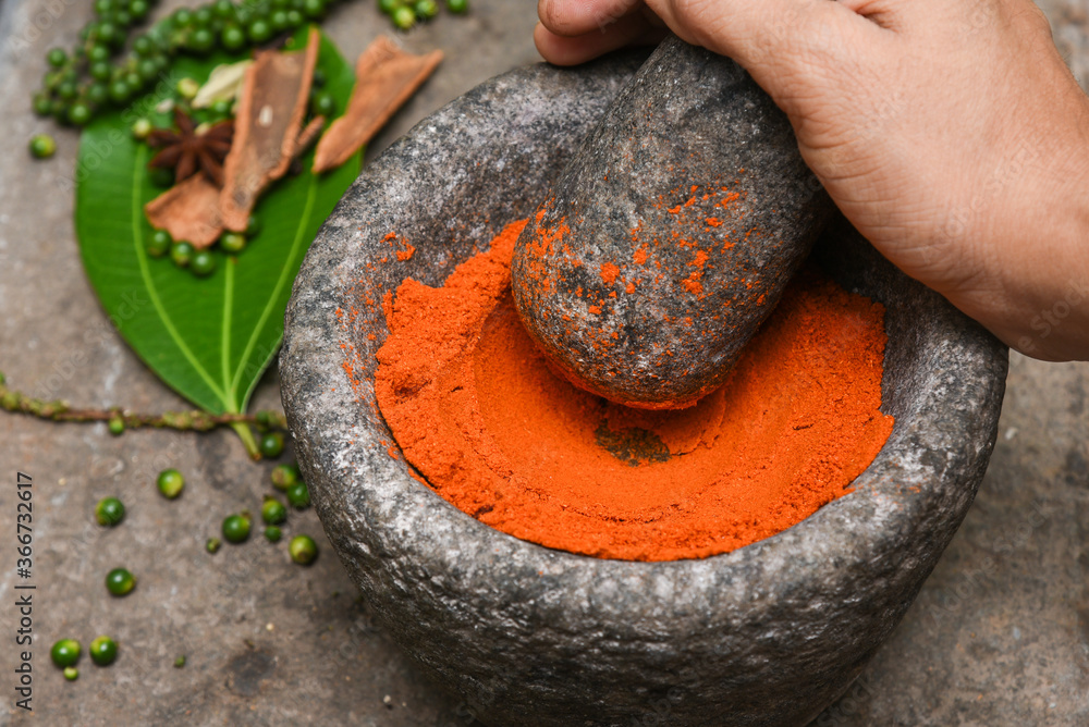 Kashmiri chilly Indian spice for hot curry, dry red chilli being ...