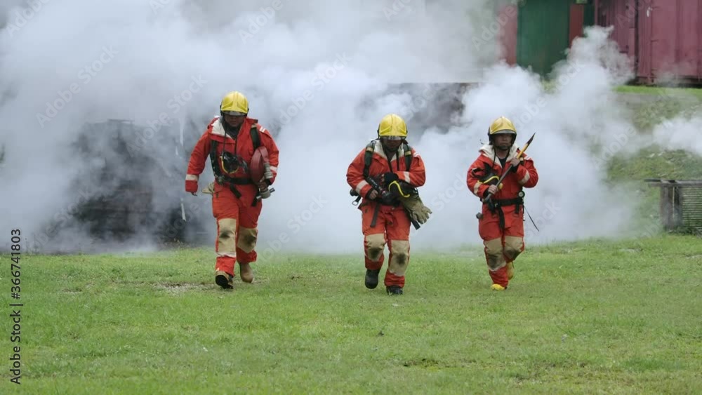 Fireman or firefighter teamwork from fire department wearing fire ...