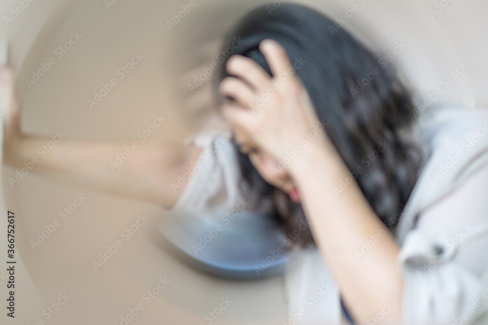 Vertigo illness concept. Blur woman hands on head felling headache ...