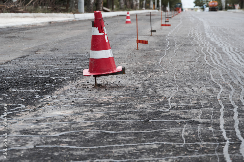 road construction or repair - laying a new layer of asphalt, marking ...