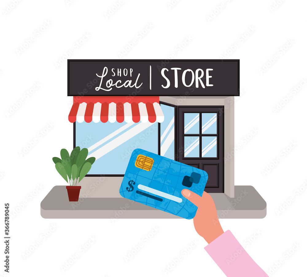 hand holding credit card in front of local store design of shop retail ...