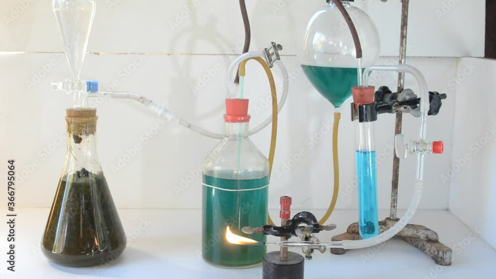 Small rig to make biogas, left reactor with biomass, then two flasks ...