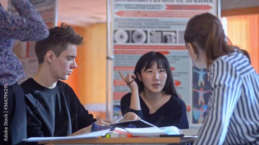 design university students brainstorming blueprint in open space. irrl ...