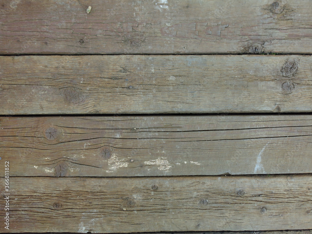 thick wooden sleepers made of old logs, brutal and harsh background ...