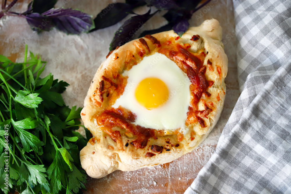 Selective focus. Khachapuri in Adjarian. Fresh homemade hot khachapuri ...