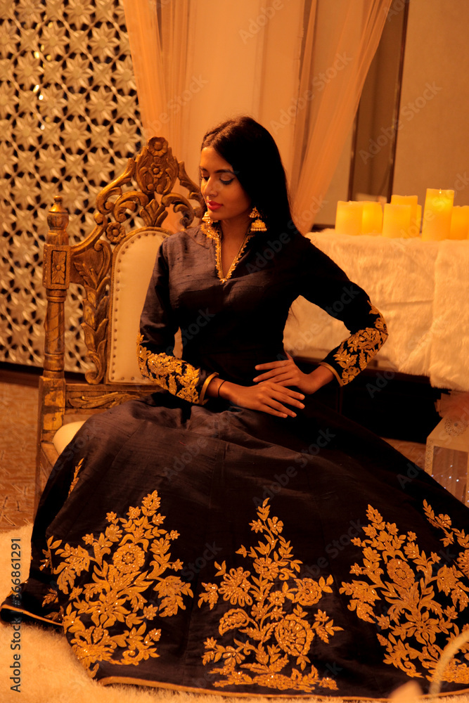 Beautiful Indian model poses in elegant dress Stock Photo | Adobe Stock