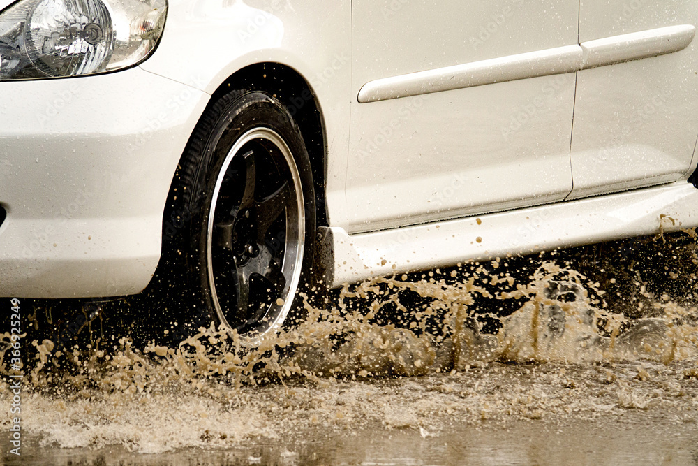 motion car rain big dirty puddle of water spray from the wheels ...