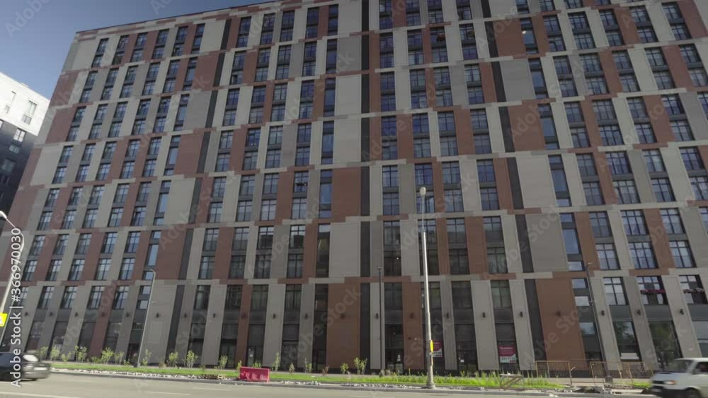 the facade of brick high-rise apartment buildings with stained glass ...