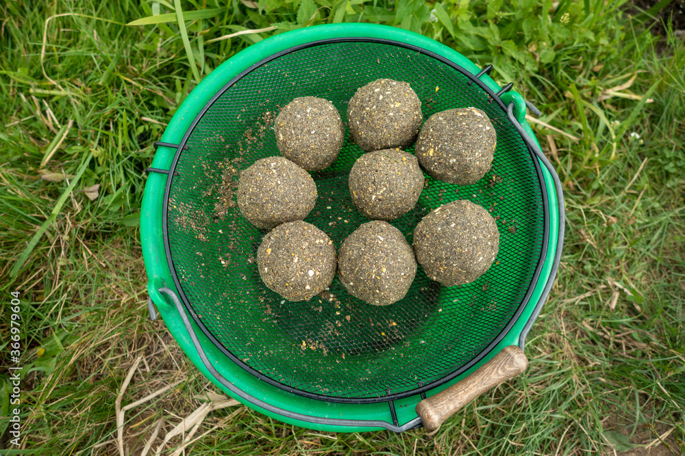 Groundbait balls ready for baiting fish. Fishing groundbait. Kule ...