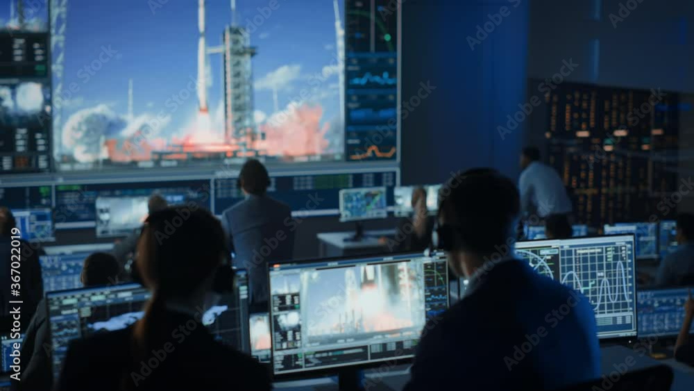 Group of People in Mission Control Center Witness Successful Space ...