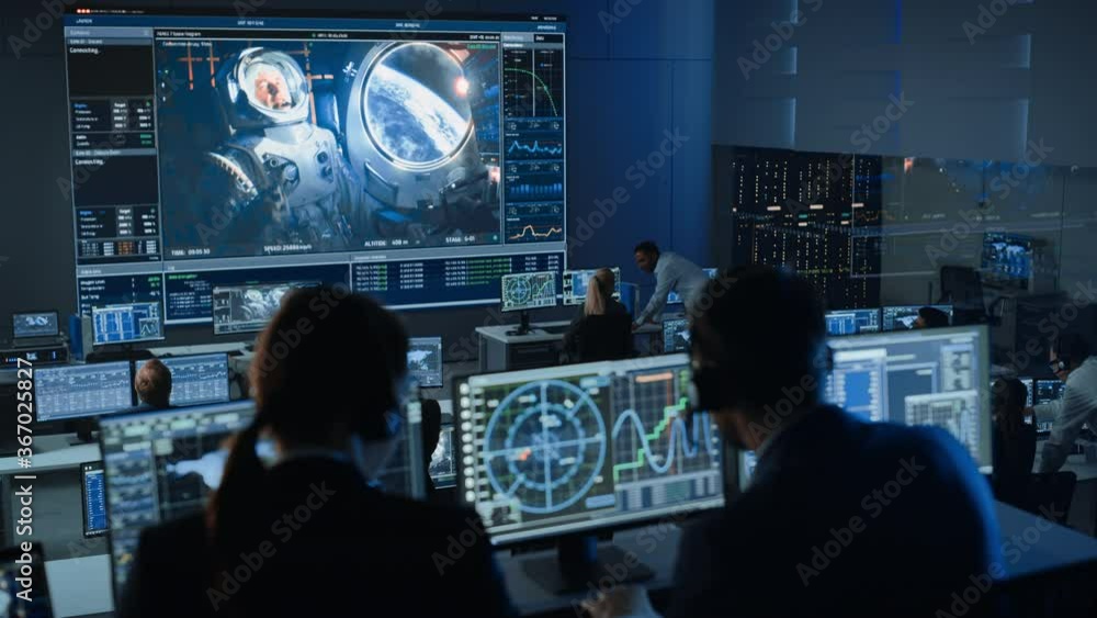 Group of People in Mission Control Center Establish Successful Video ...