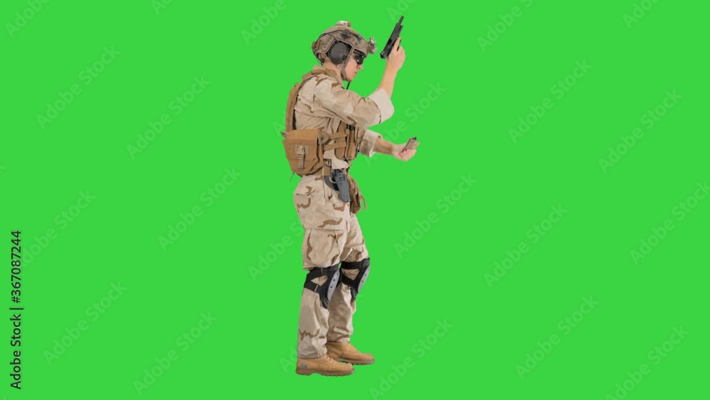 Special operations training Soldier walking and shooting from hand gun ...