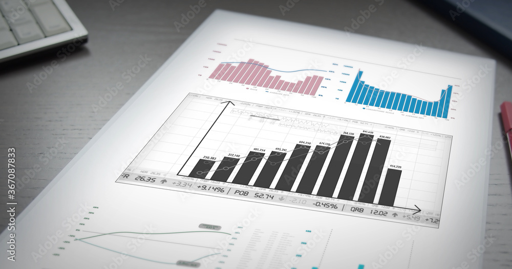 Financial data on paper lying on an office table. Graphs, Diagram ...
