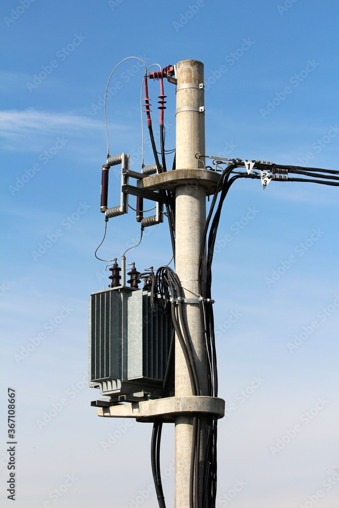 Strong metal electric power transformer with grey utility box mounted ...