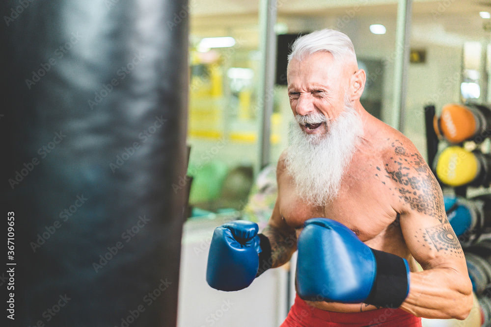 Hipster senior man boxing inside training fitness gym club - Mature fit ...