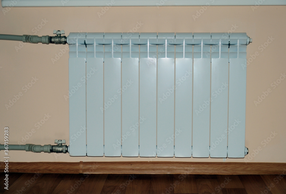 Installation of a bimetallic radiator for water heating with the ...